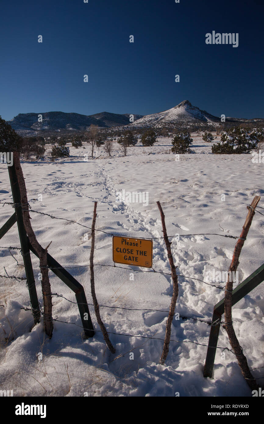 Snowy landscape at a gate in the Coronado National Forest in New Mexico ...