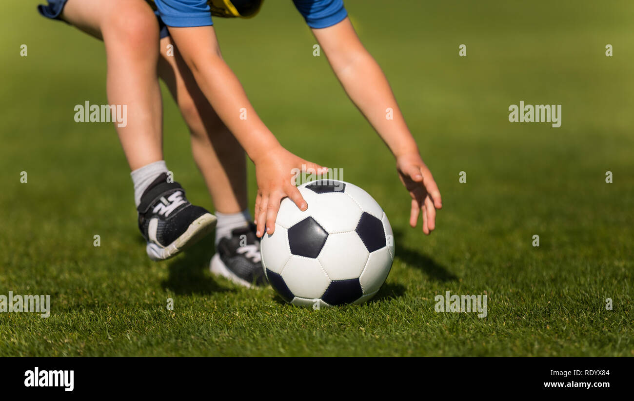 Boy catching ball hi-res stock photography and images - Alamy