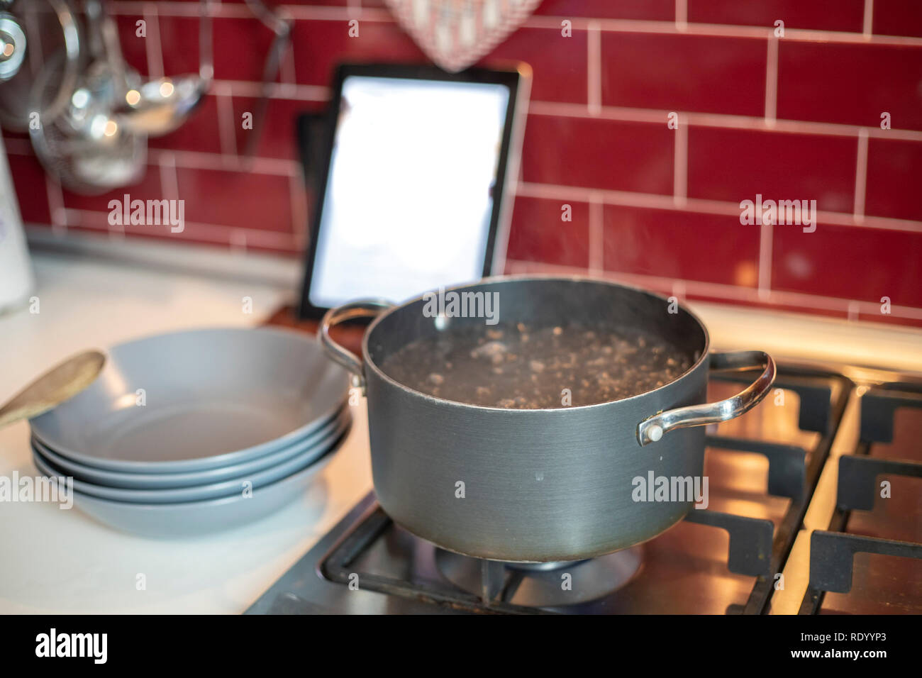 Cooking on gas stove hi-res stock photography and images - Alamy