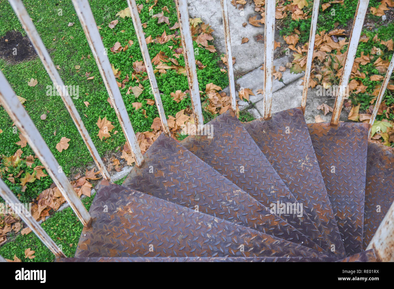 Rusty iron old dirty stairs going down from city building Stock Photo ...
