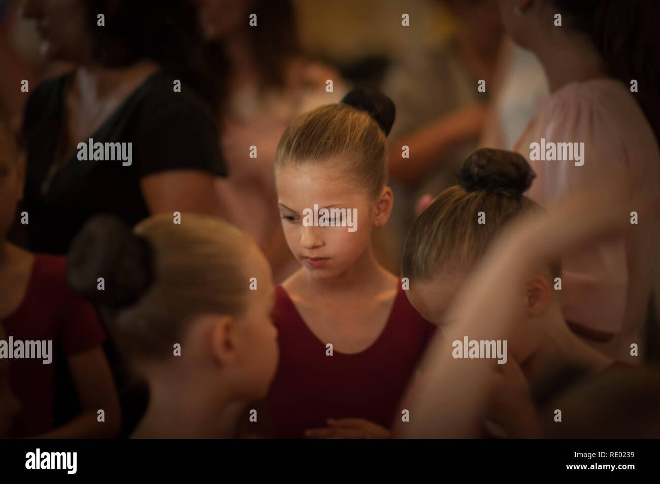 beautiful little girl among russian ballet school students before show ...