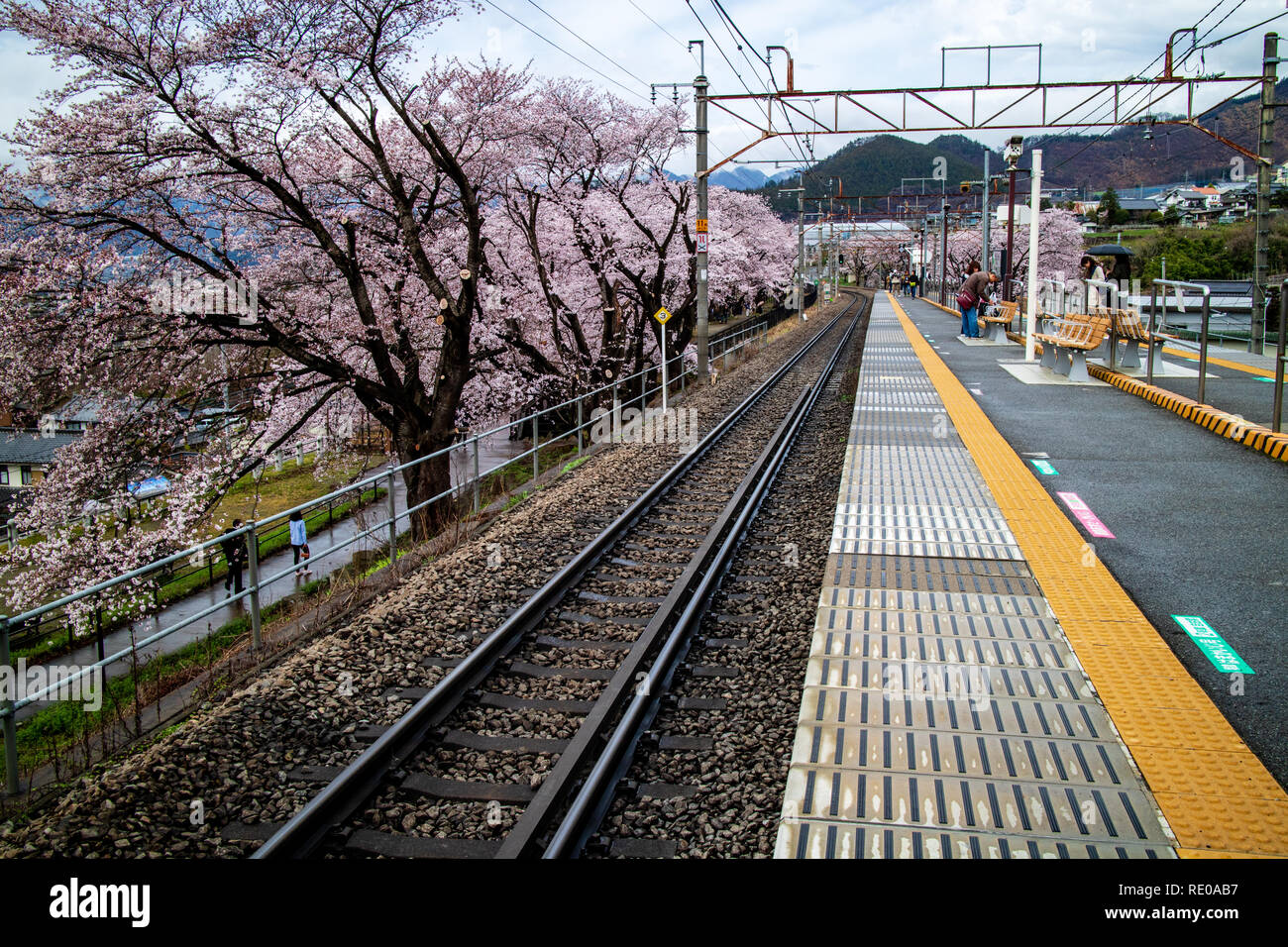 Yamanashi, Japan - 9/4/2017: A train line and station platform next to ...