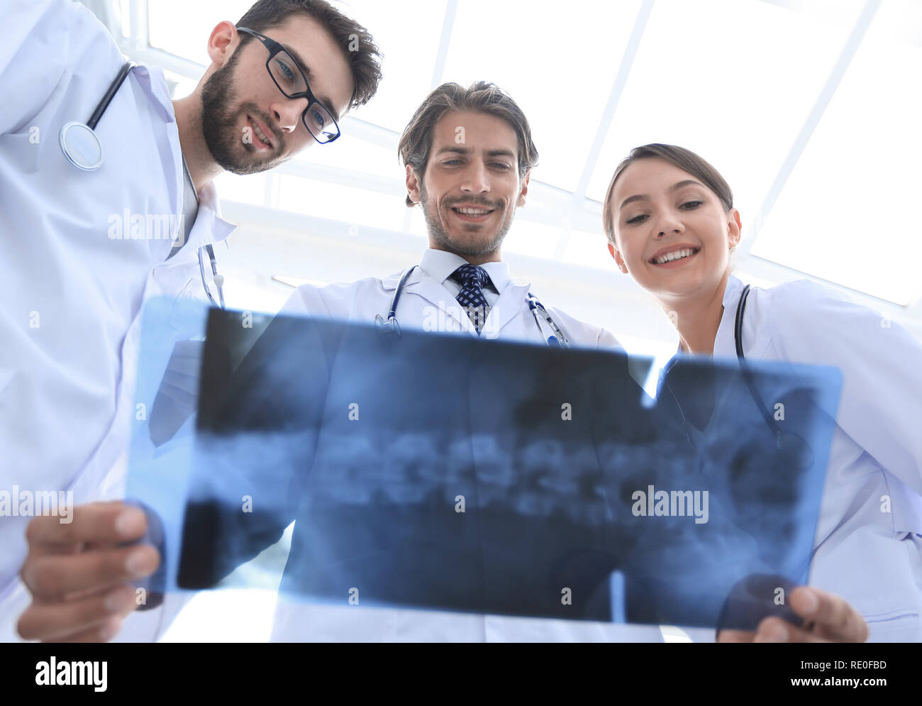 bottom view young group of doctors looking at x-ray Stock Photo - Alamy