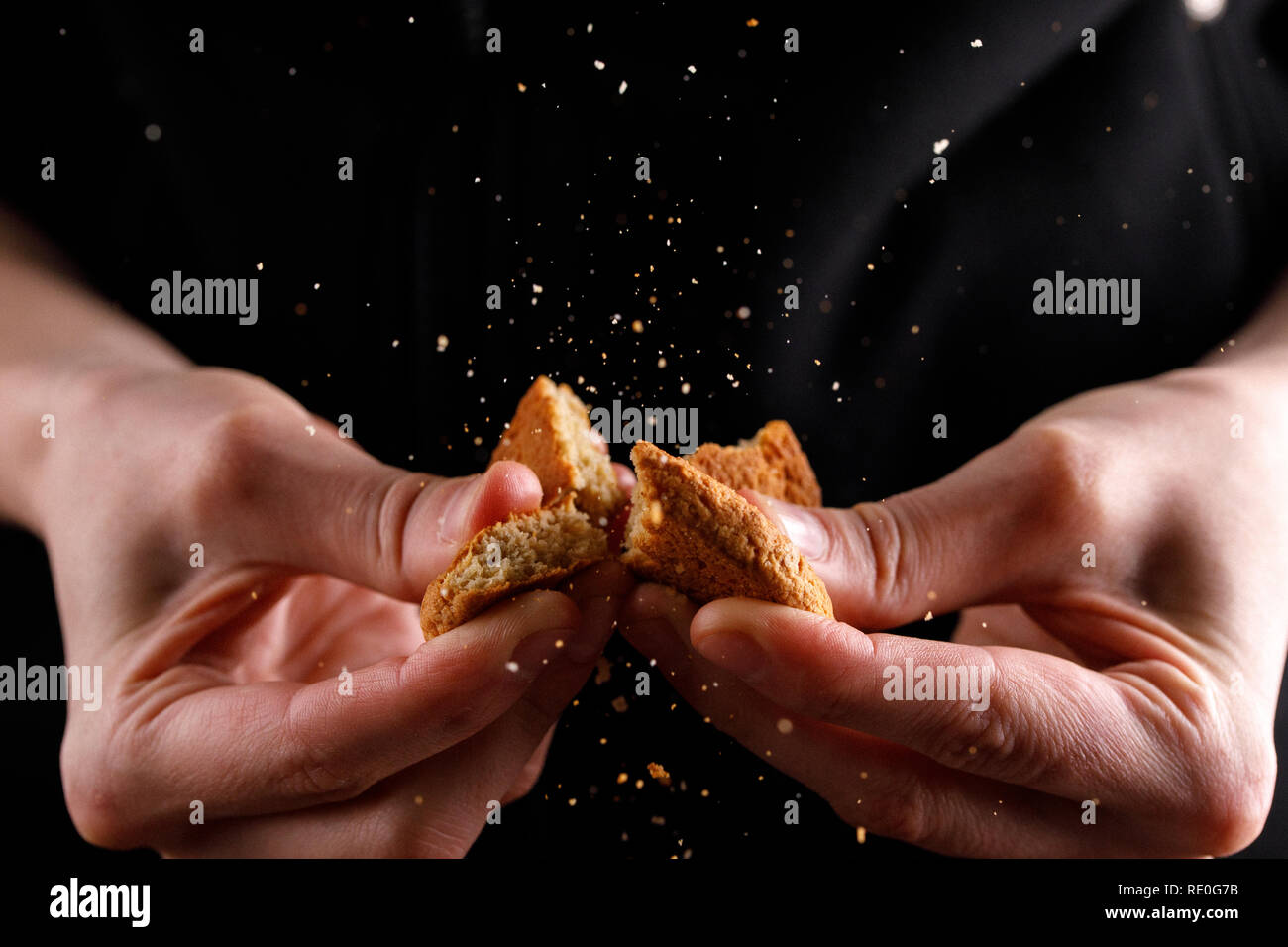 Breaking sweet delicious pastry hands hi-res stock photography and ...