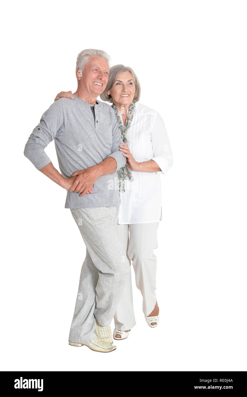 Portrait of senior couple hugging on white background, full length ...