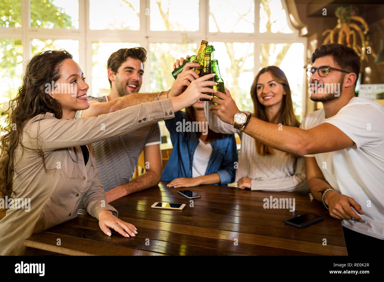 Group table drinks toast hi-res stock photography and images - Alamy