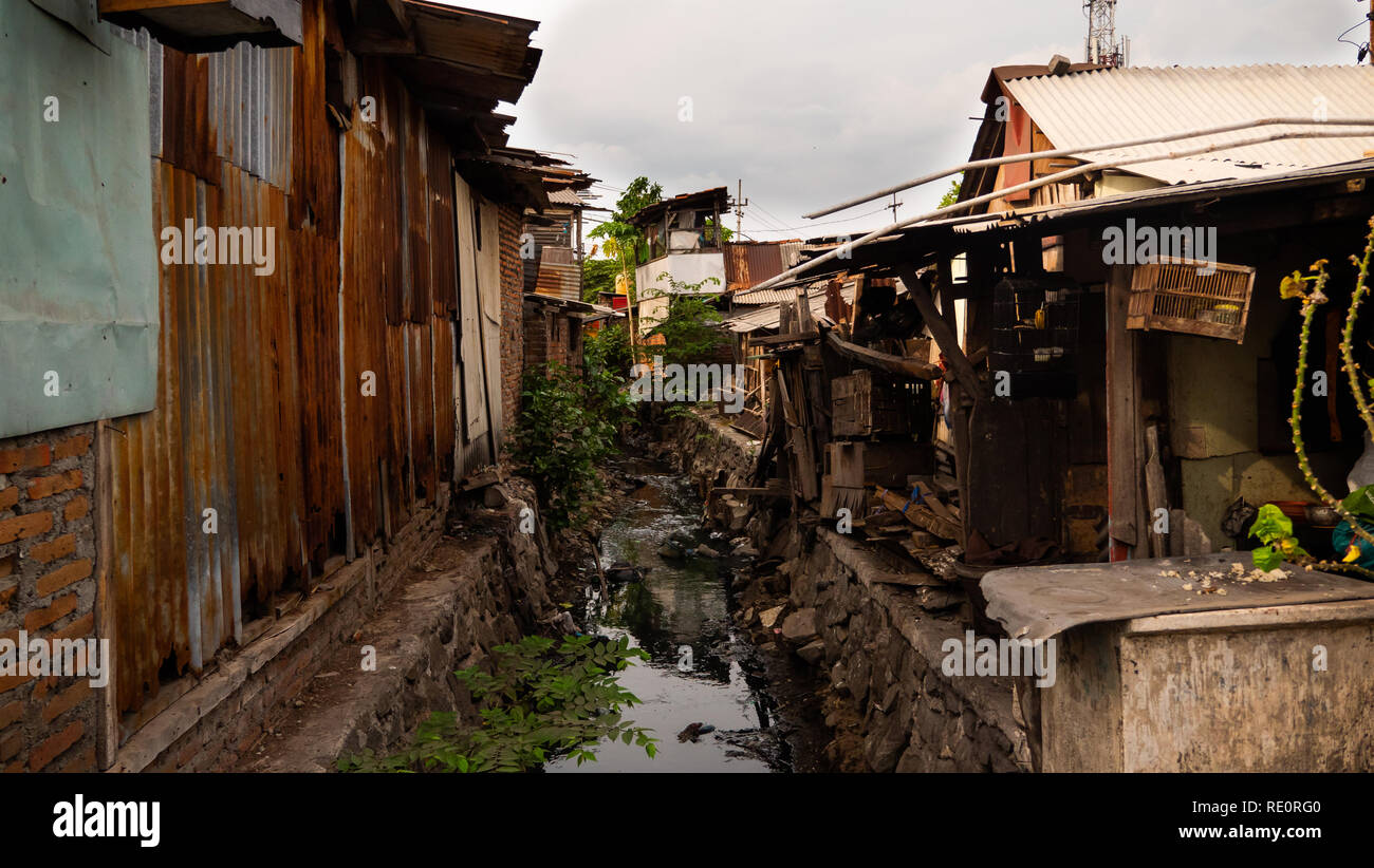 Poor area with slums and sewers in Indonesia. Poor asian city block ...