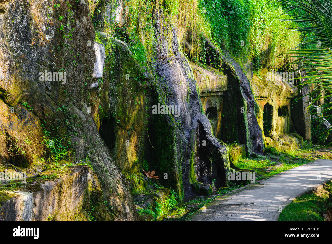 Carved in the stone ancient Gunung Kawi Temple with royal tombs ...