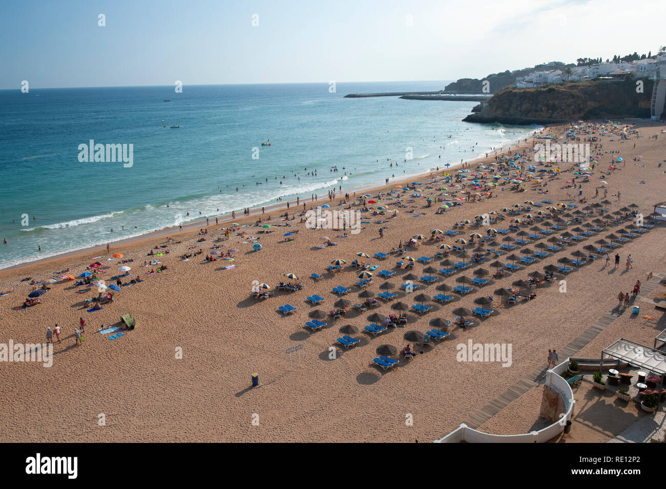 Sunbathers on the sandy beach Praia do Túnel, Albufeira, Algarve ...