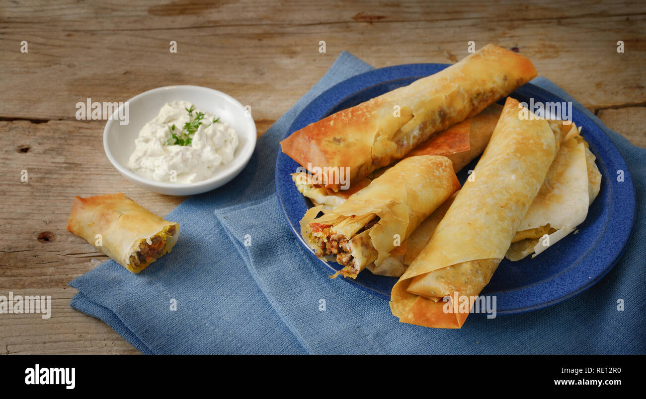fstuffed filo or yufka dough rolls and curd cheese, pastry with a spicy ...