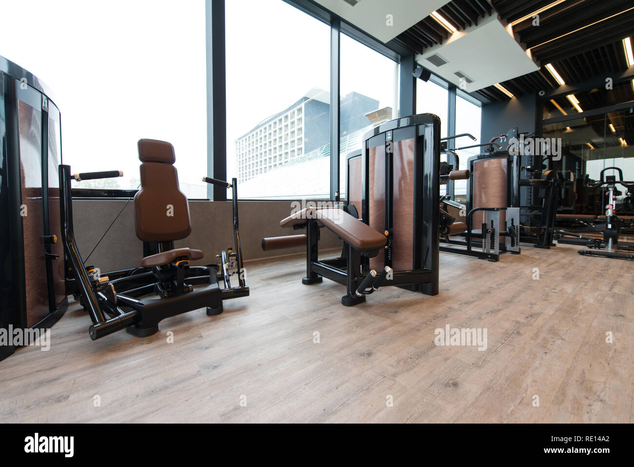 Modern Gym Room Fitness Center With Equipment And Machines Stock Photo ...