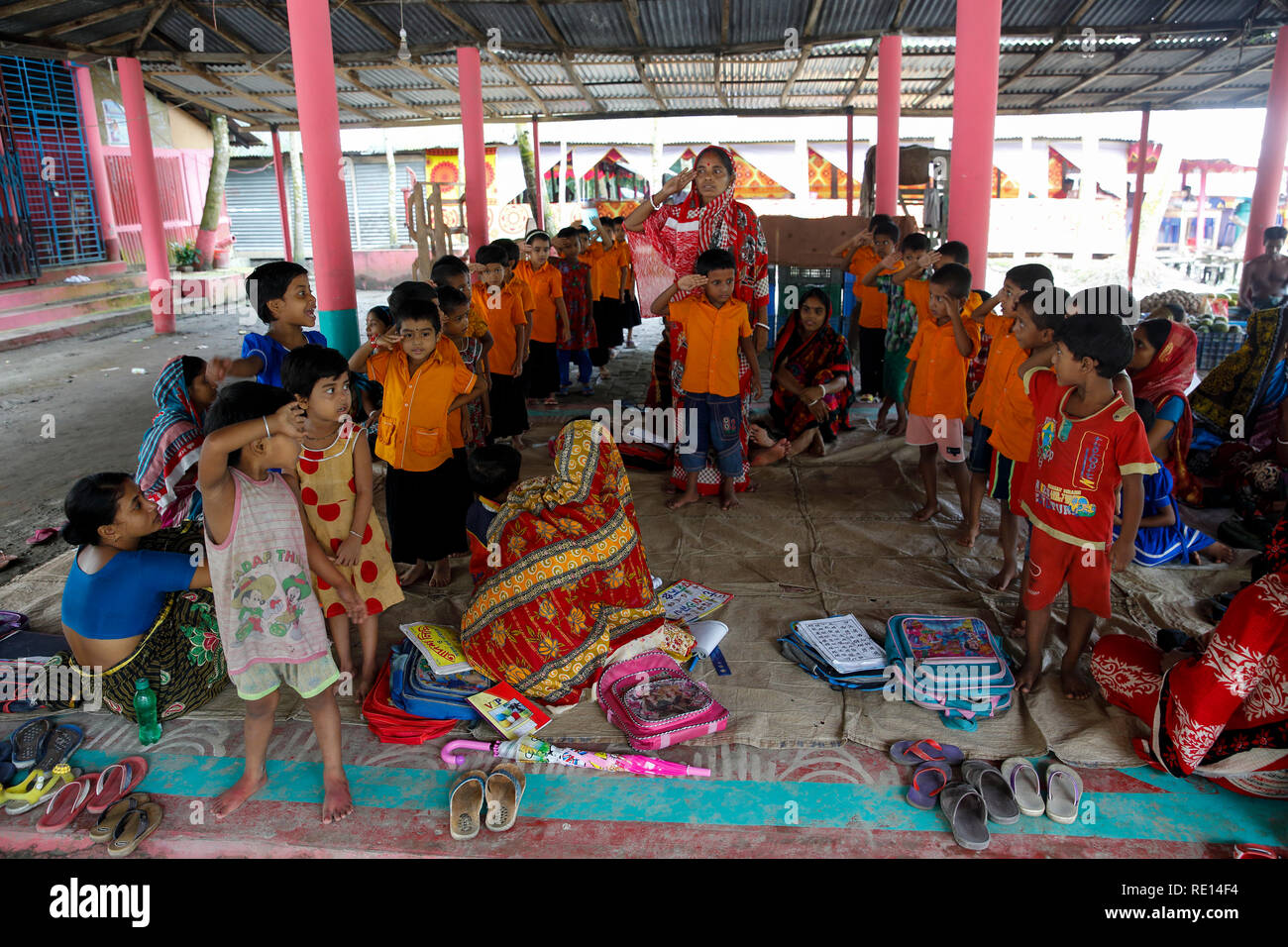 Students learn their lesson from the teacher inside a temple ...