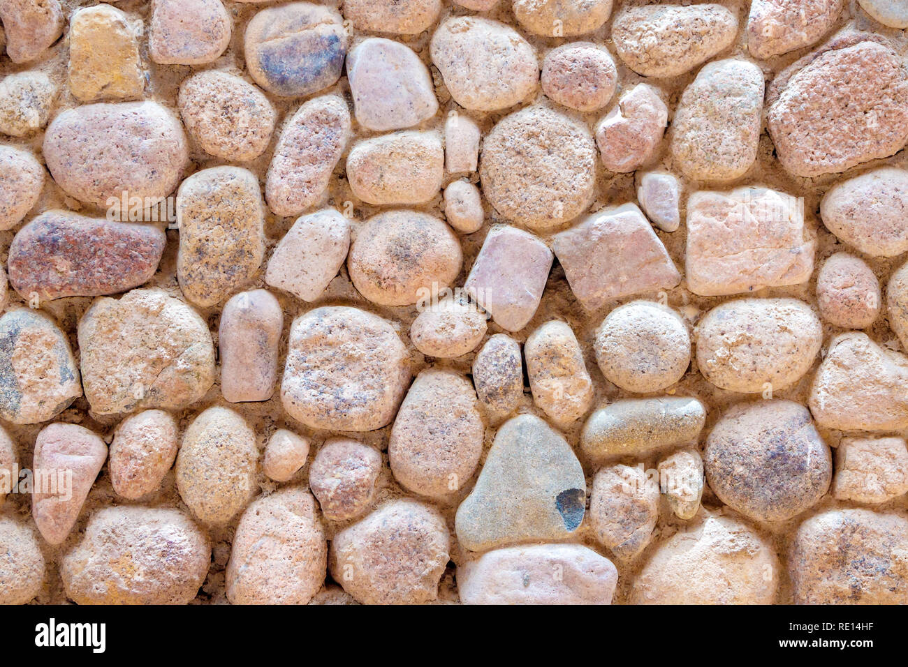 Fragment of a wall from a colour chipped stone background texture photo ...