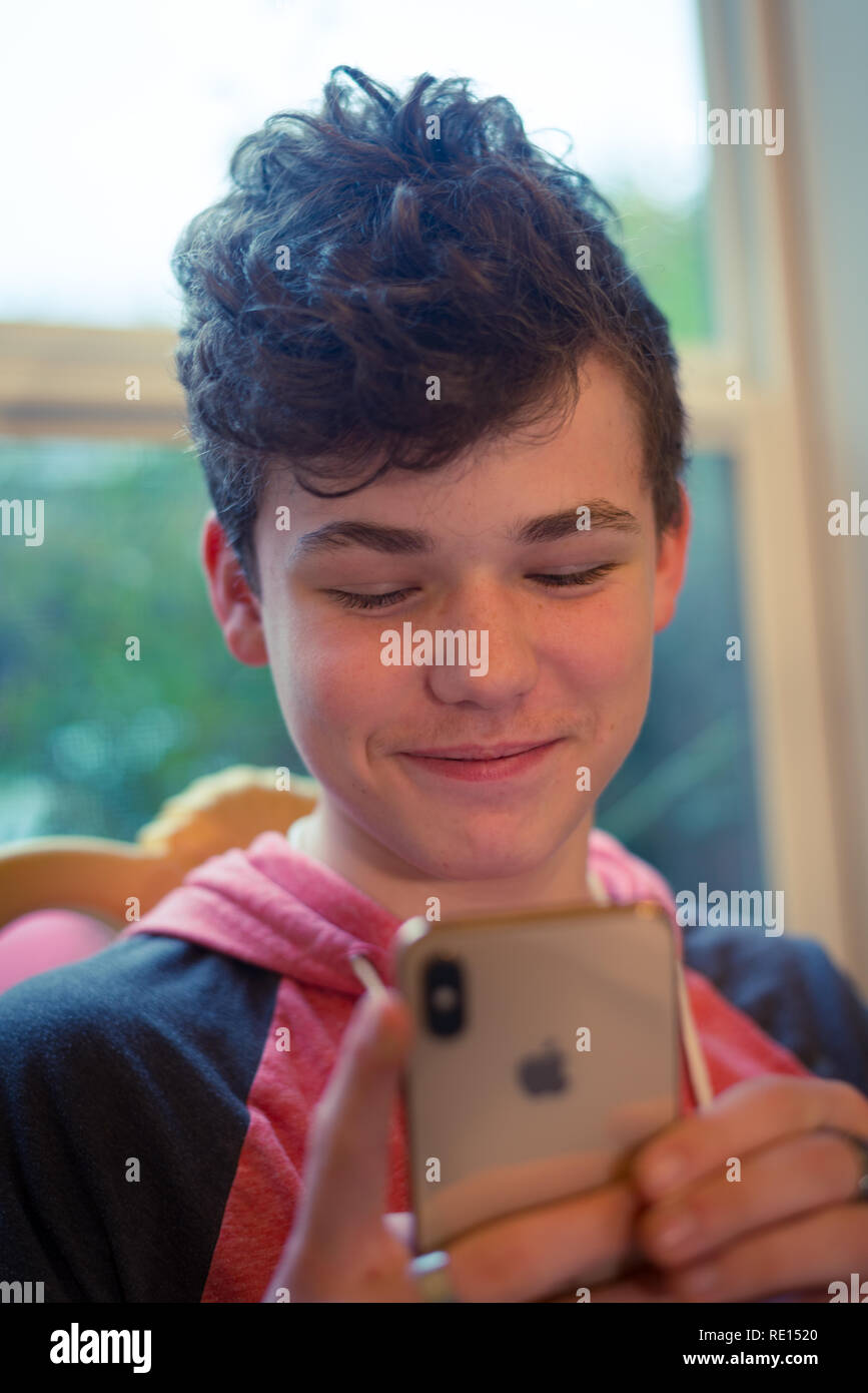 Teenage boy with his new iPhone x Stock Photo - Alamy