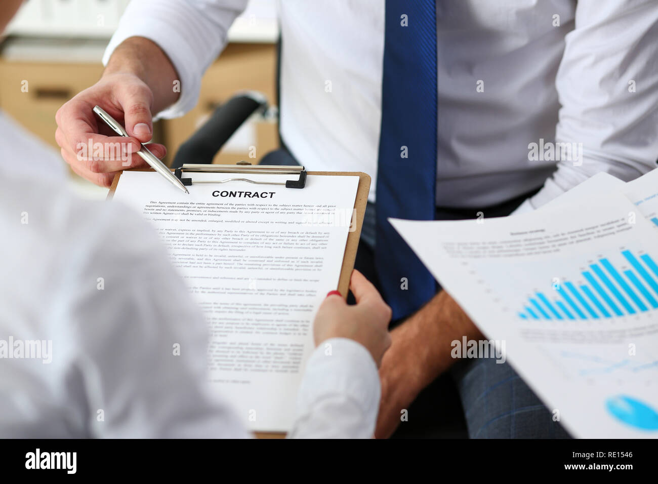 Male arm offer contract form on clipboard pad Stock Photo - Alamy