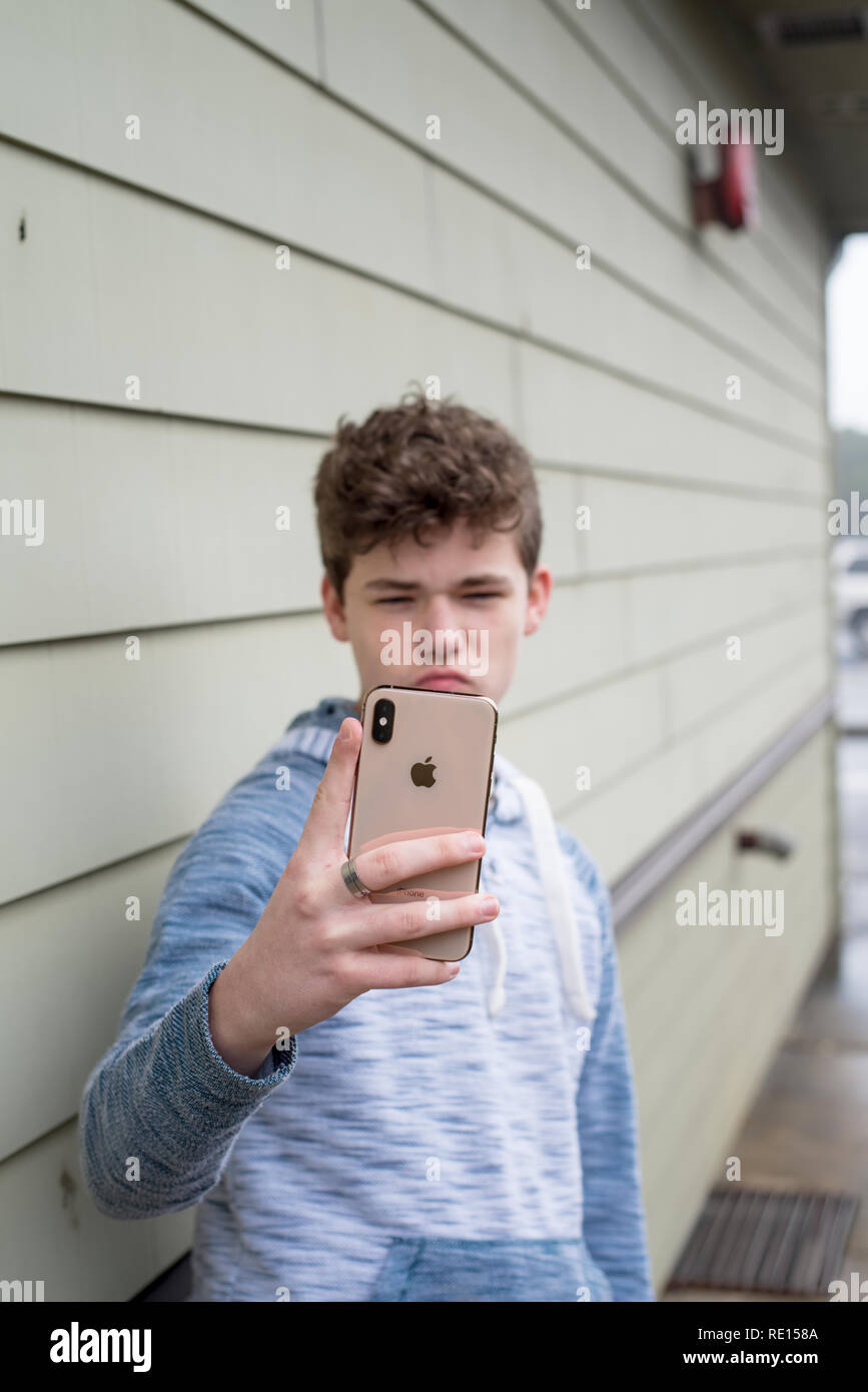 Teenage boy taking a selfie with his new iPhone X Stock Photo - Alamy