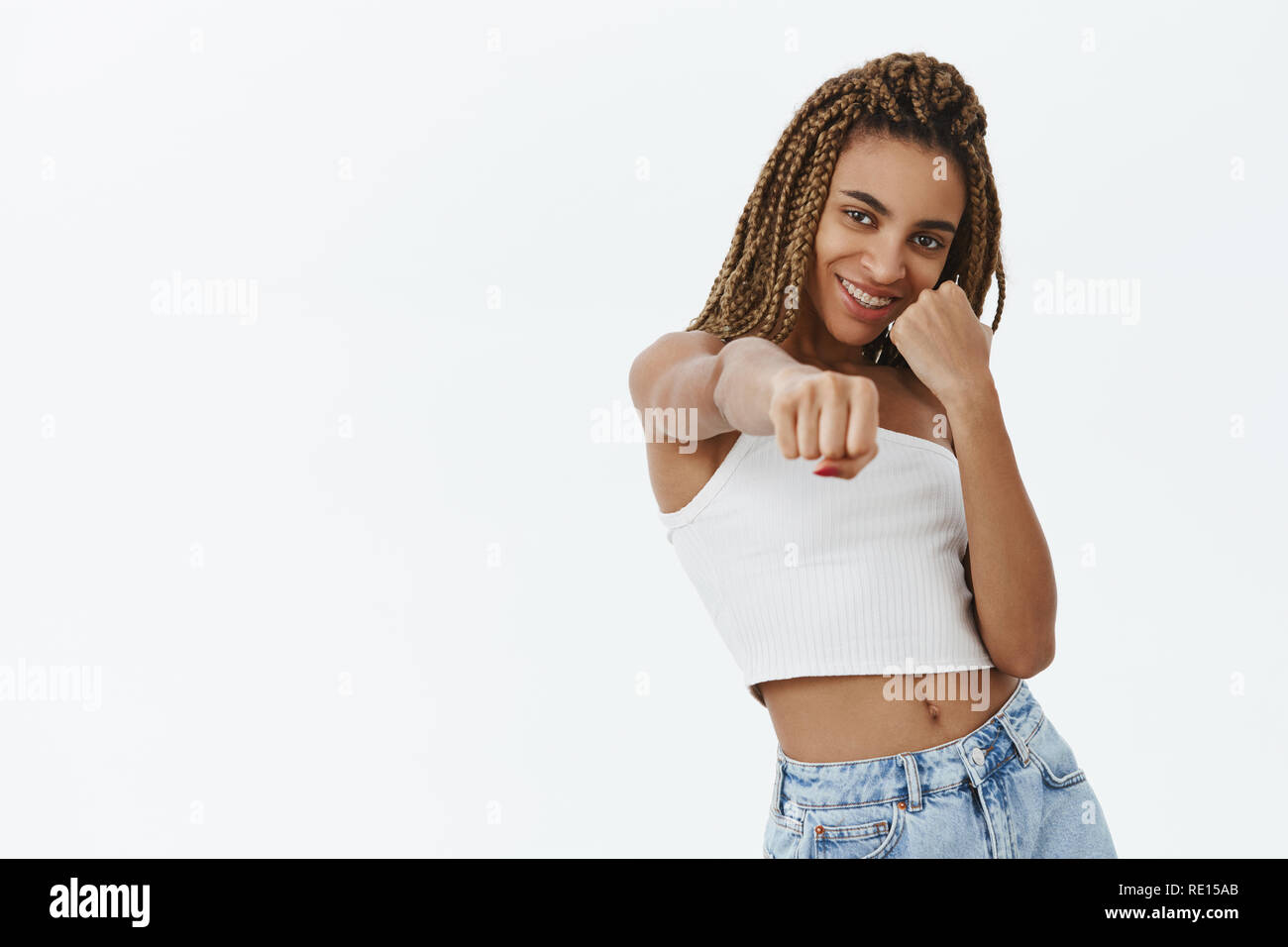 Indoor shot of stylish and attractive african-american woman with cool ...