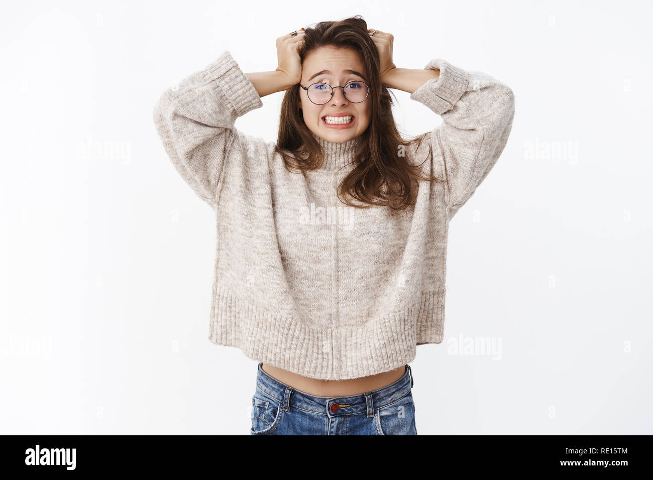 Jeez I am in trouble. Portrait of worried and freaked out young girl ...