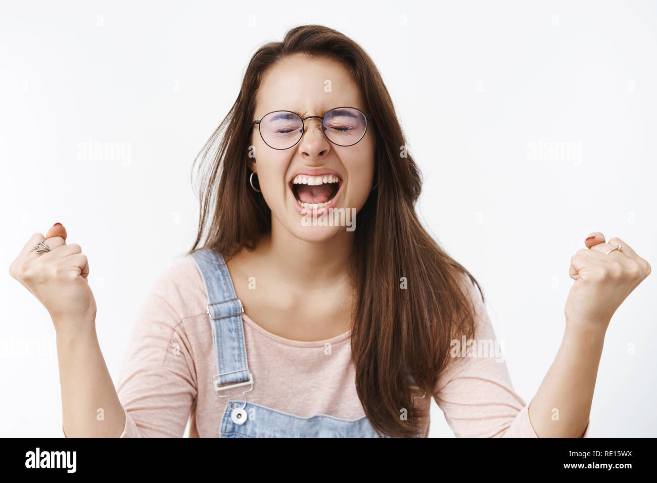 Fed up pressured young female coworker in glasses letting out rage and ...