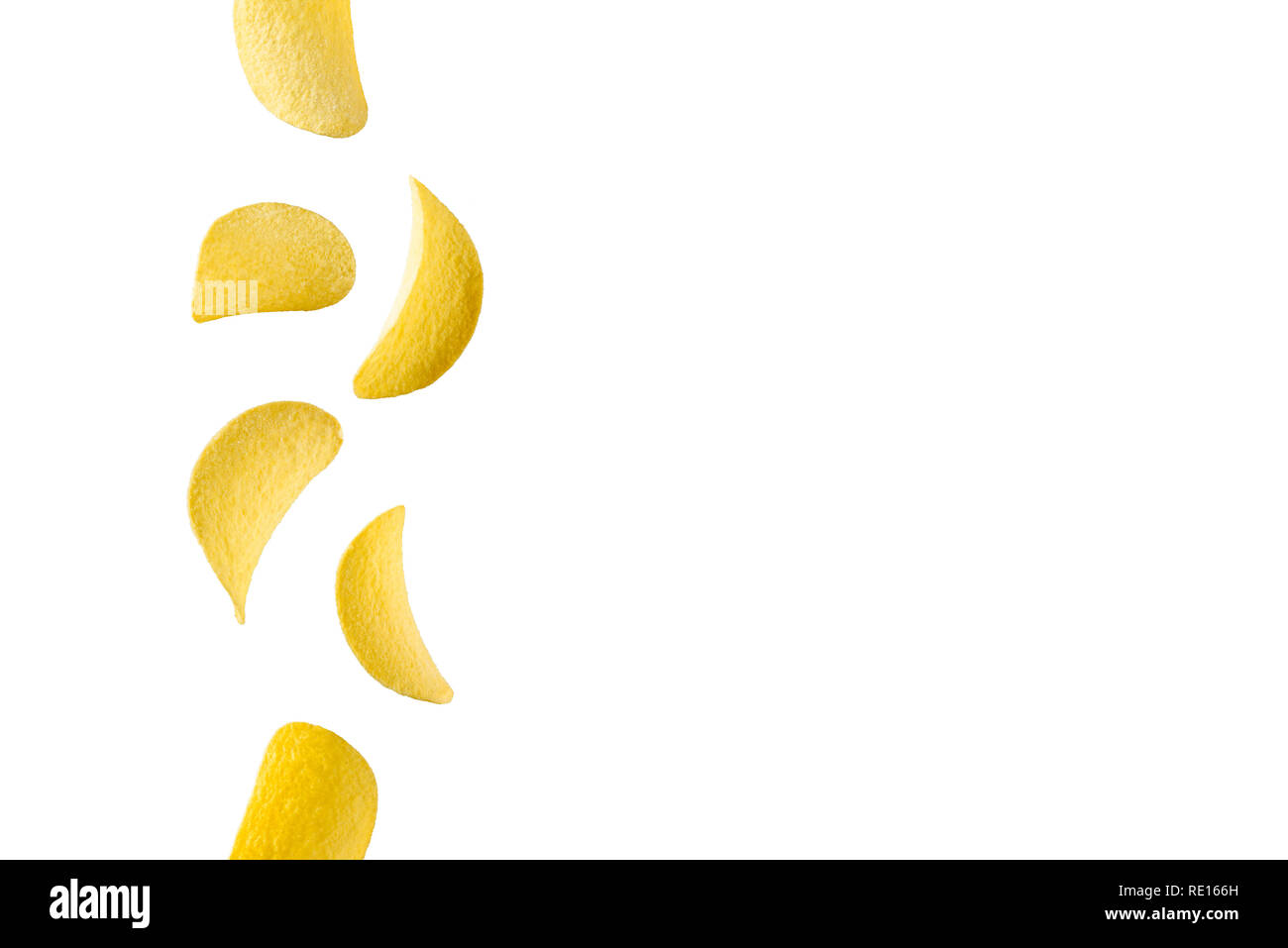 Falling potato chips isolated on white background. Flying crispy snacks ...
