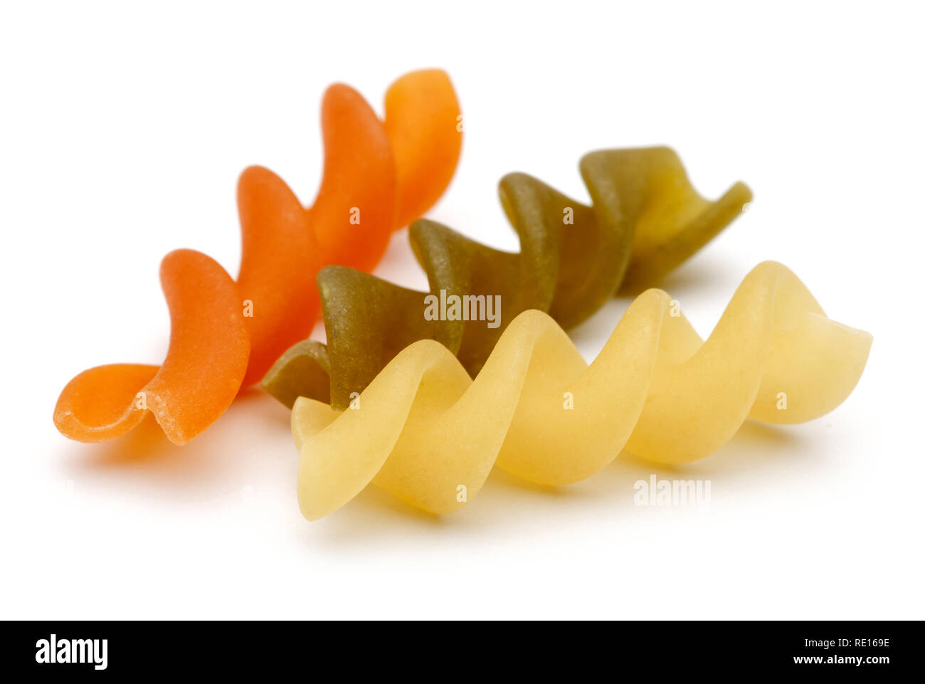 Mixed color fusilli pasta isolated on white background Stock Photo - Alamy