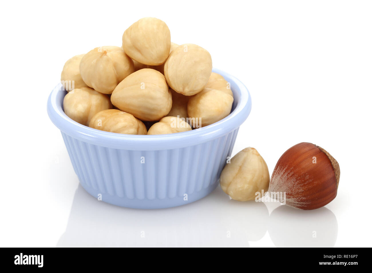 Hazelnuts in bowl isolated on white background Stock Photo - Alamy