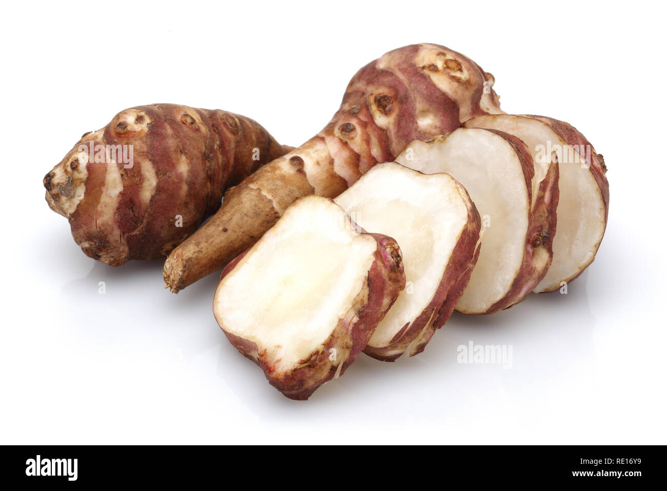 Jerusalem artichoke or sweet potato and slices isolated on white ...