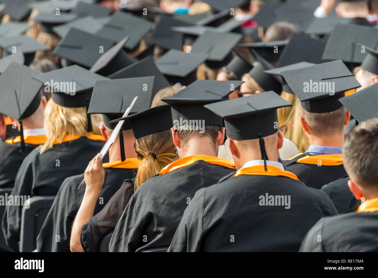 Yong student wearing graduation caps at a graduation ceremony Stock ...