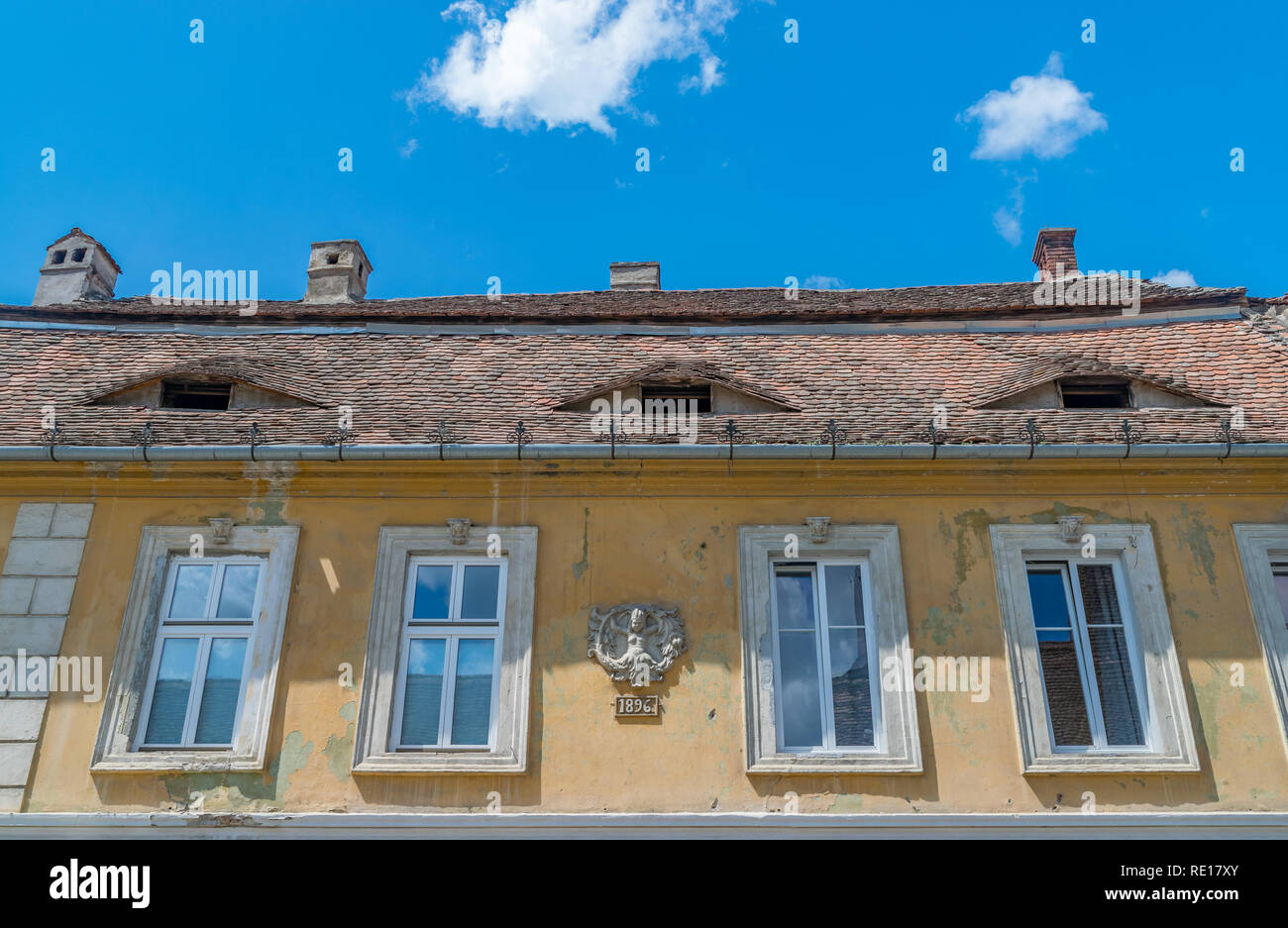 House with eyes on a sunny summer day with blue sky in Sibiu, Romania ...