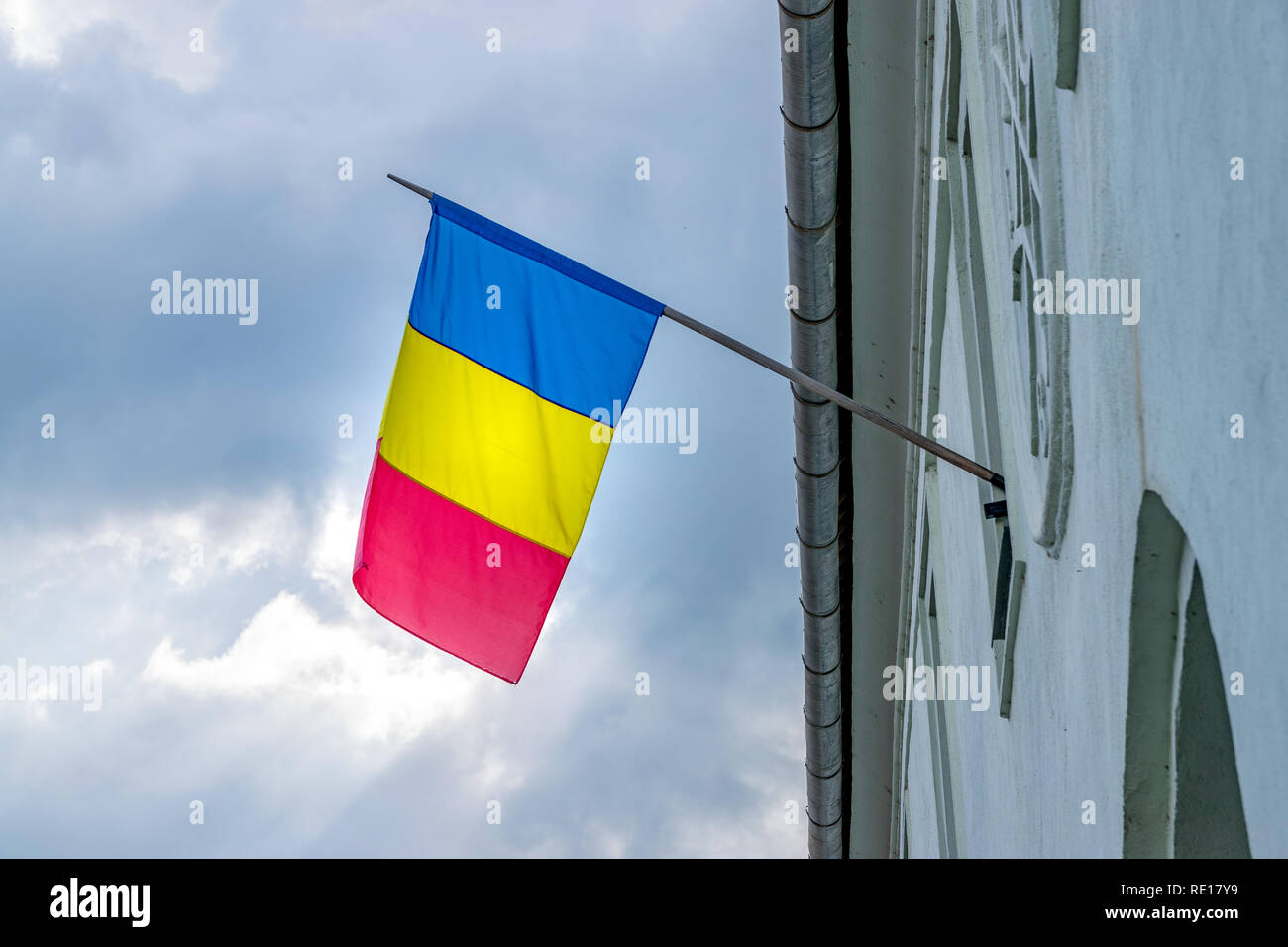 Romanian flag on a house in Sibiu, Romania Stock Photo - Alamy