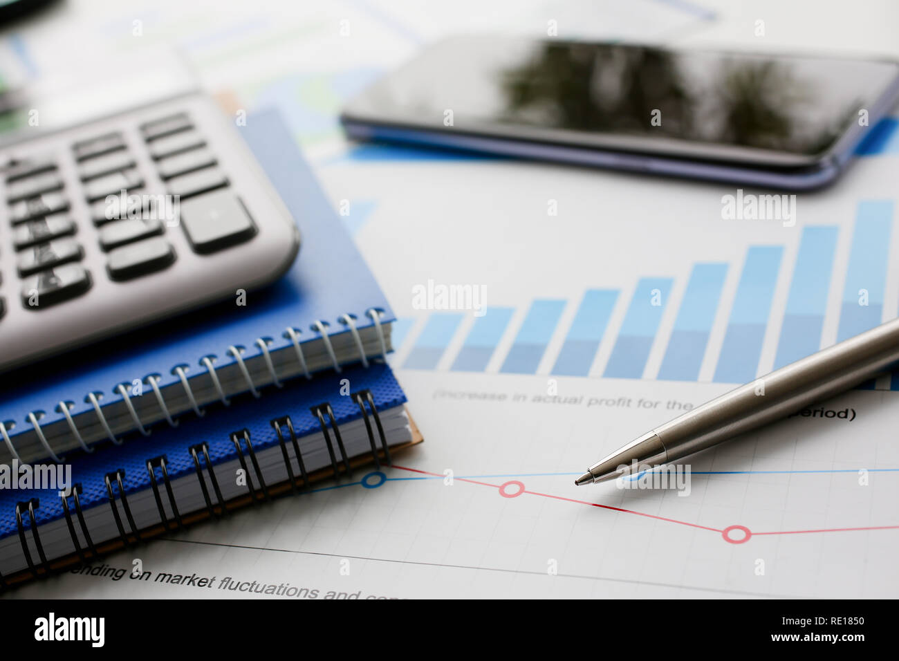 Silver calculator with gray keyboard is lying Stock Photo - Alamy
