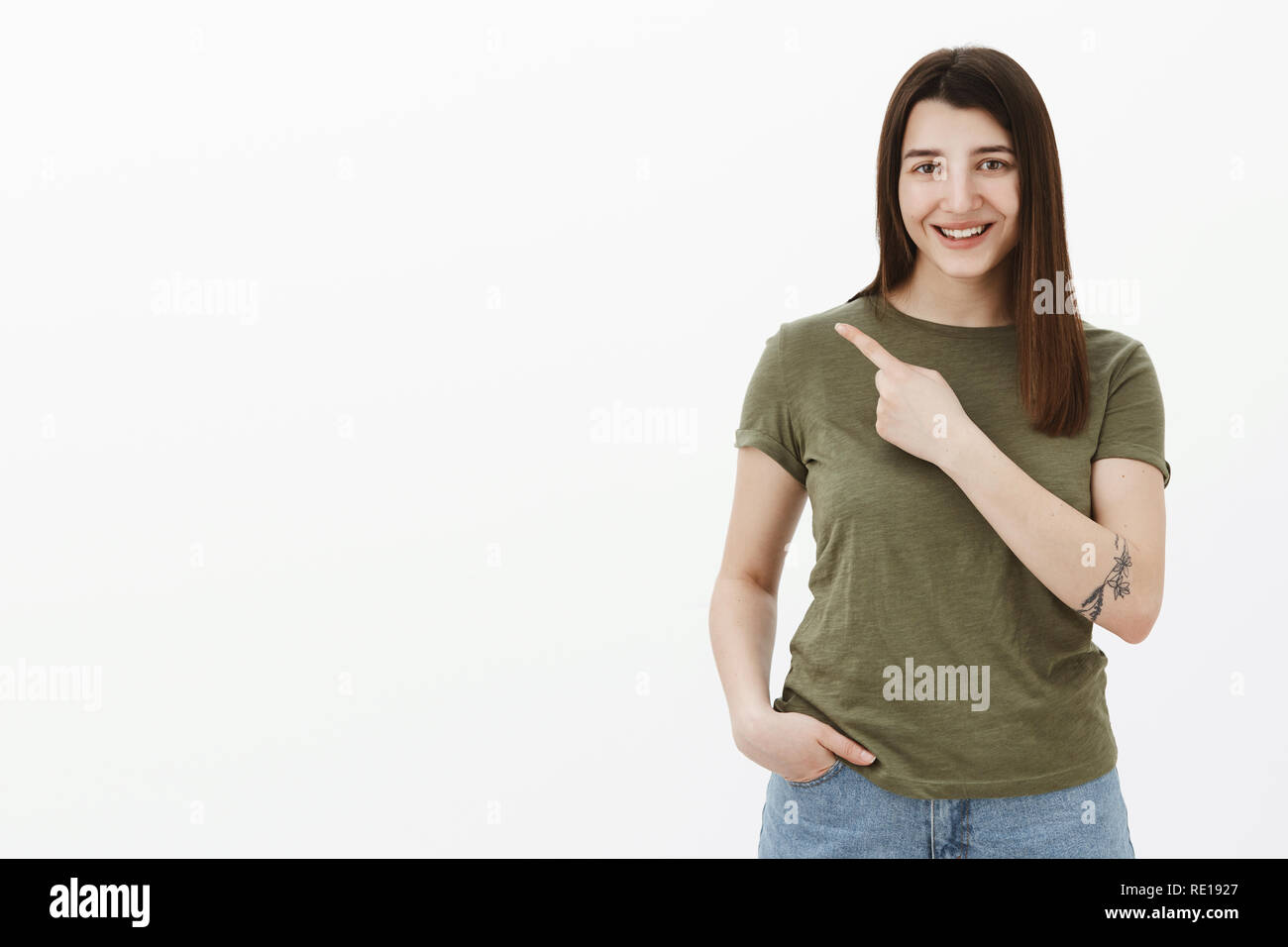 Girl inviting you, showing place. Happy carefree and relaxed friendly ...