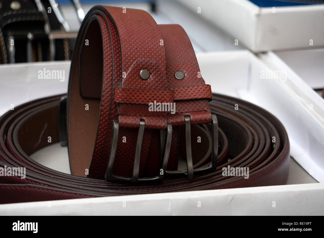 many different colors leather belt on display at the market for sale ...