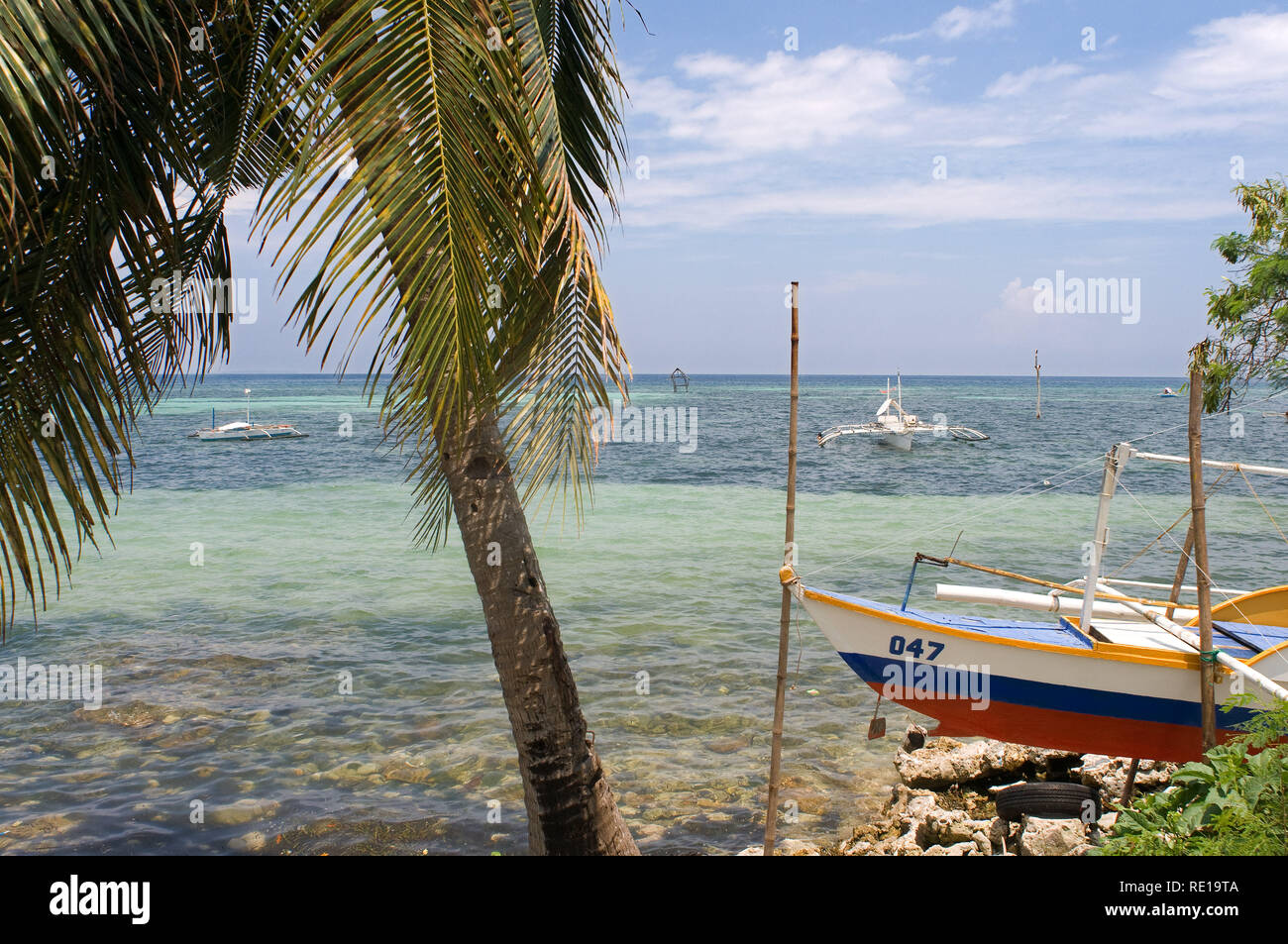 The famous Philippine boats called Bankas sailing. Baclayon. Bohol ...
