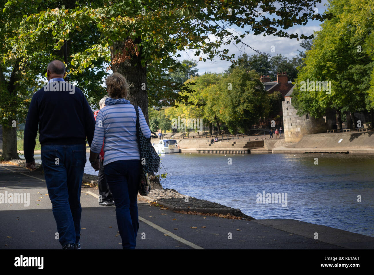 Woman walking next to river hi-res stock photography and images - Alamy