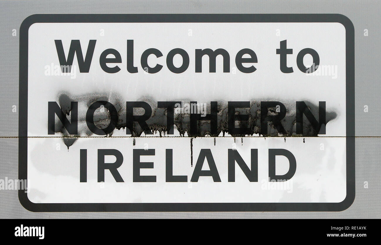 A defaced road sign on border between donegal hi-res stock photography ...