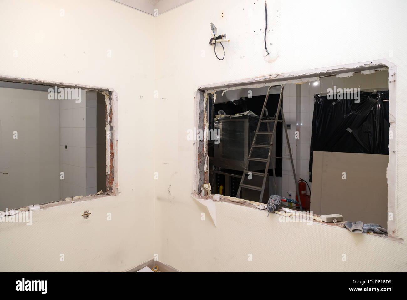 Repair and replacement windows in office building, destroyed window ...