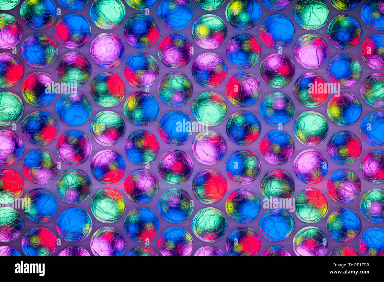 A bright multicolored image taken through a sheet of plastic bubble ...