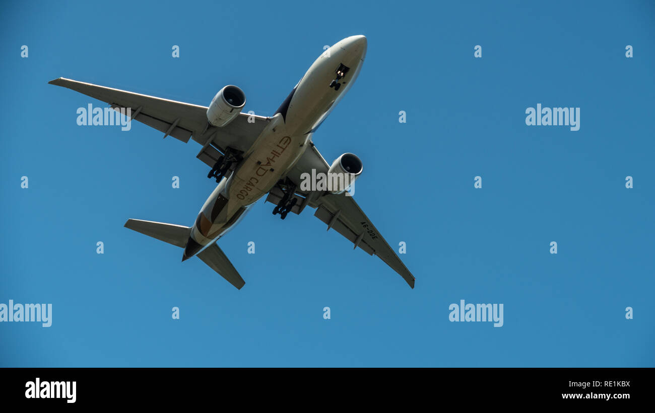 Airplane in Blue Sky Stock Photo - Alamy