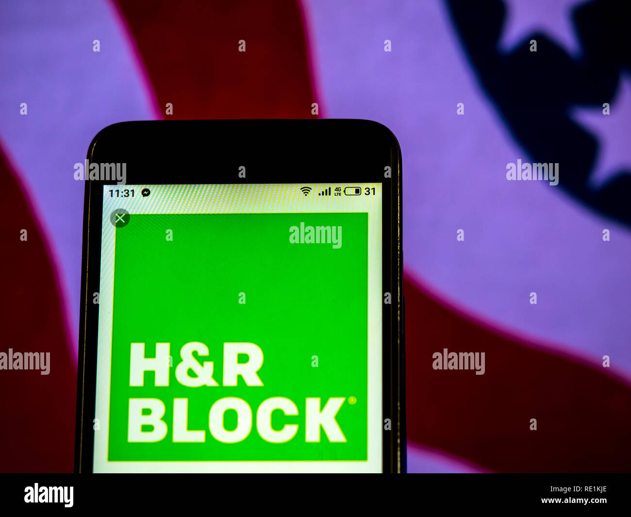 H&R Block Tax preparation company logo seen displayed on smart phone ...