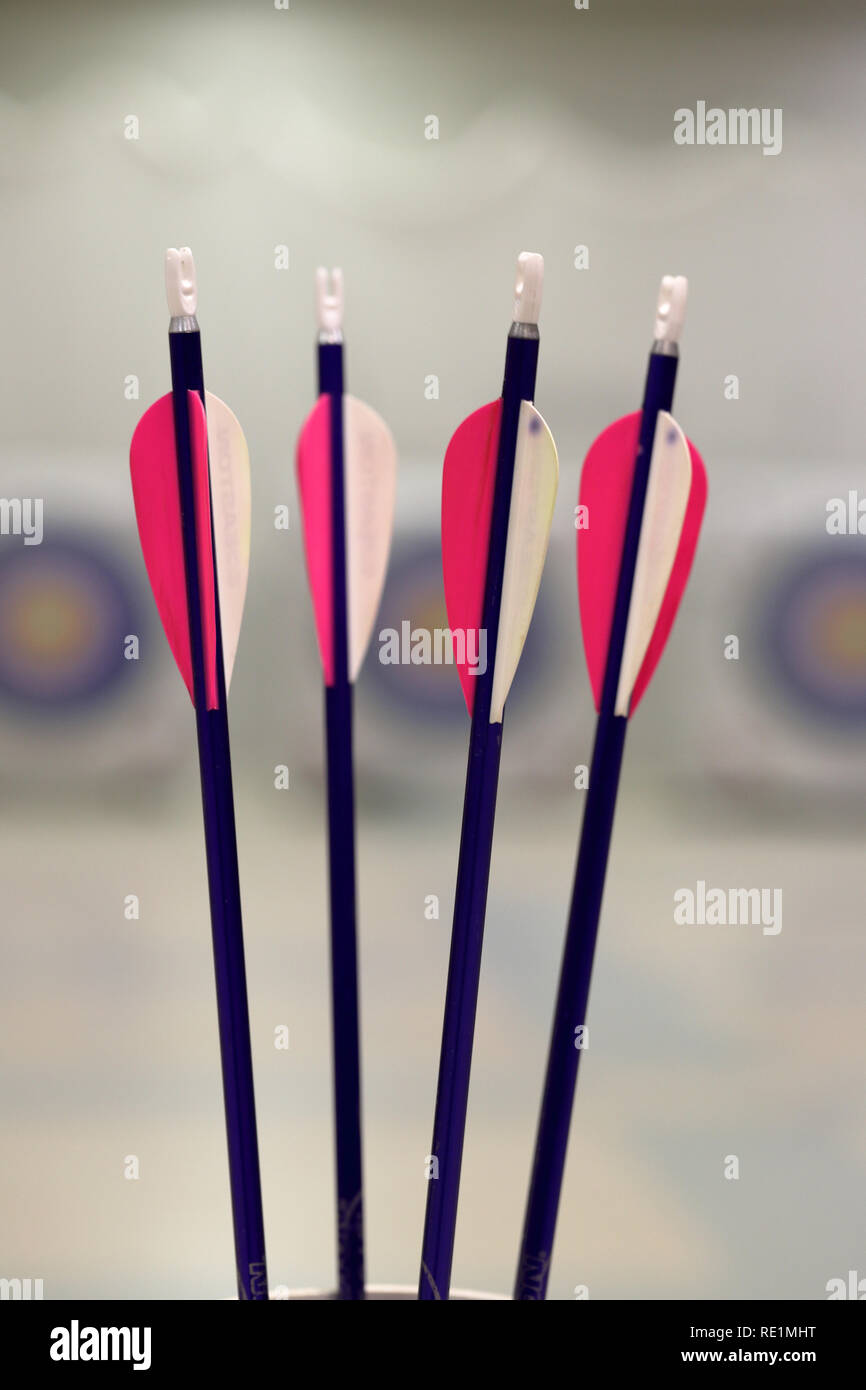 Pink bow arrows hi-res stock photography and images - Alamy