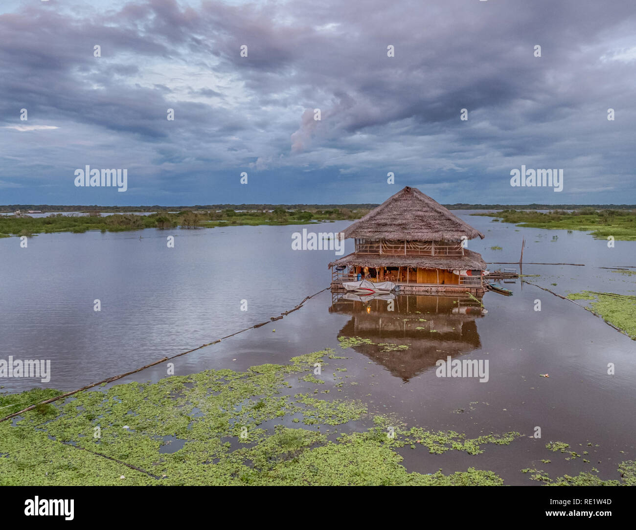 Iquitos, Peru- March 29, 2018: View of a floating house and the Itaya ...
