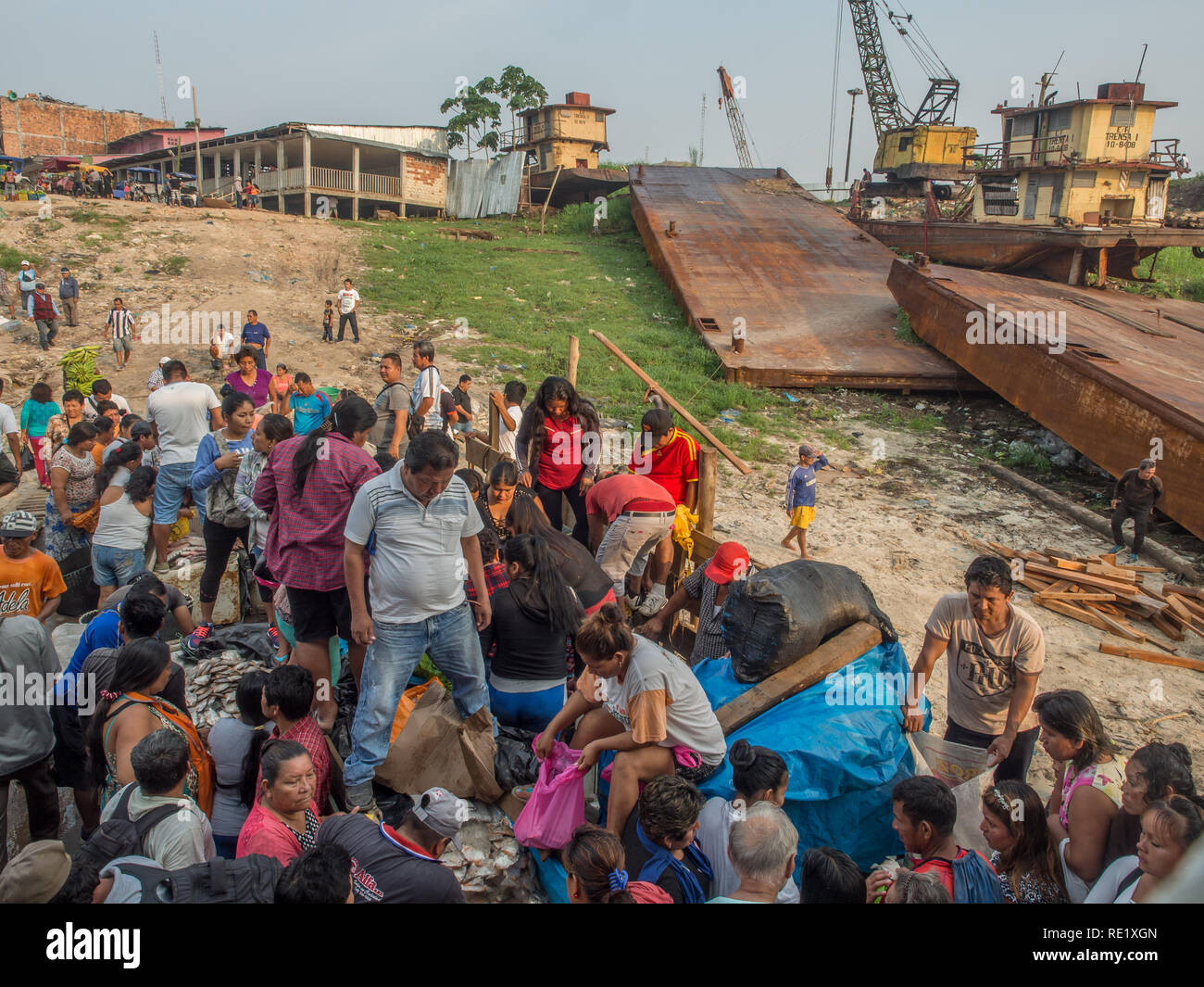 Iquitos, Peru - Sep 21, 2017: A crowd of local people on a board cargo ...