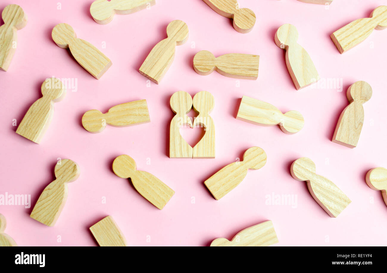 Two human figures together form a void in the shape of a heart on a ...