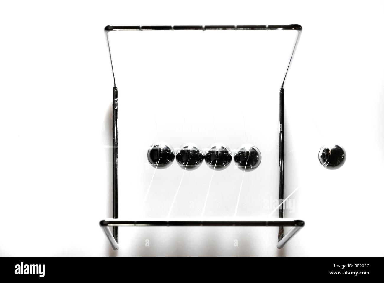 Newton's cradle, ball pendulum Stock Photo - Alamy