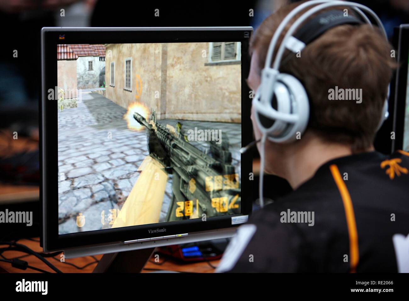 Boys playing game shooting screen guns hi-res stock photography and ...