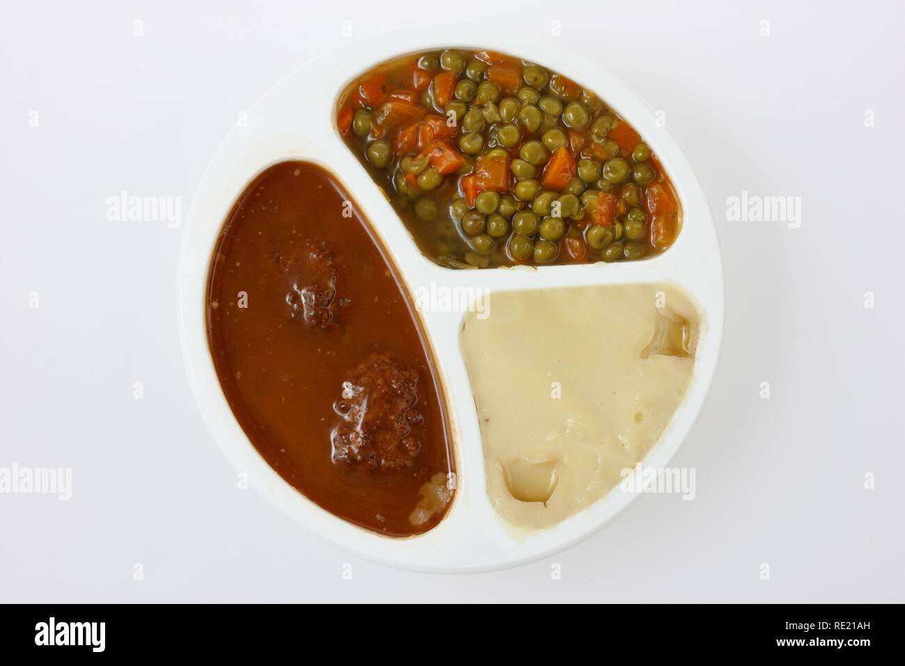 Meal in a plastic container, pre-cooked, portioned for one person, meat ...