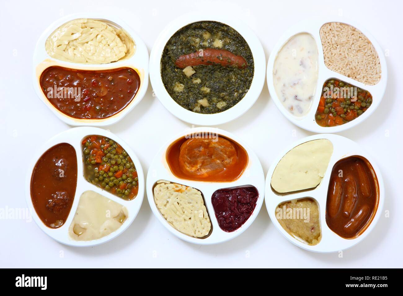 Different meals in plastic containers, pre-cooked, portioned for one ...