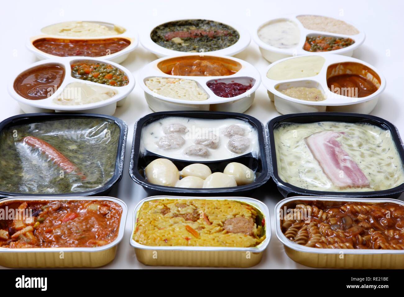 Different meals in plastic containers, pre-cooked, portioned for one ...