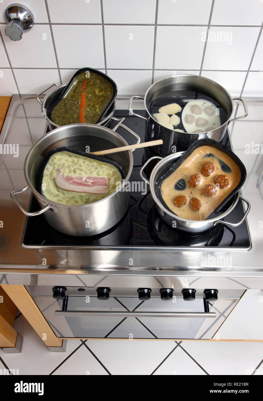 Heating prepared meals in a water bath Stock Photo - Alamy